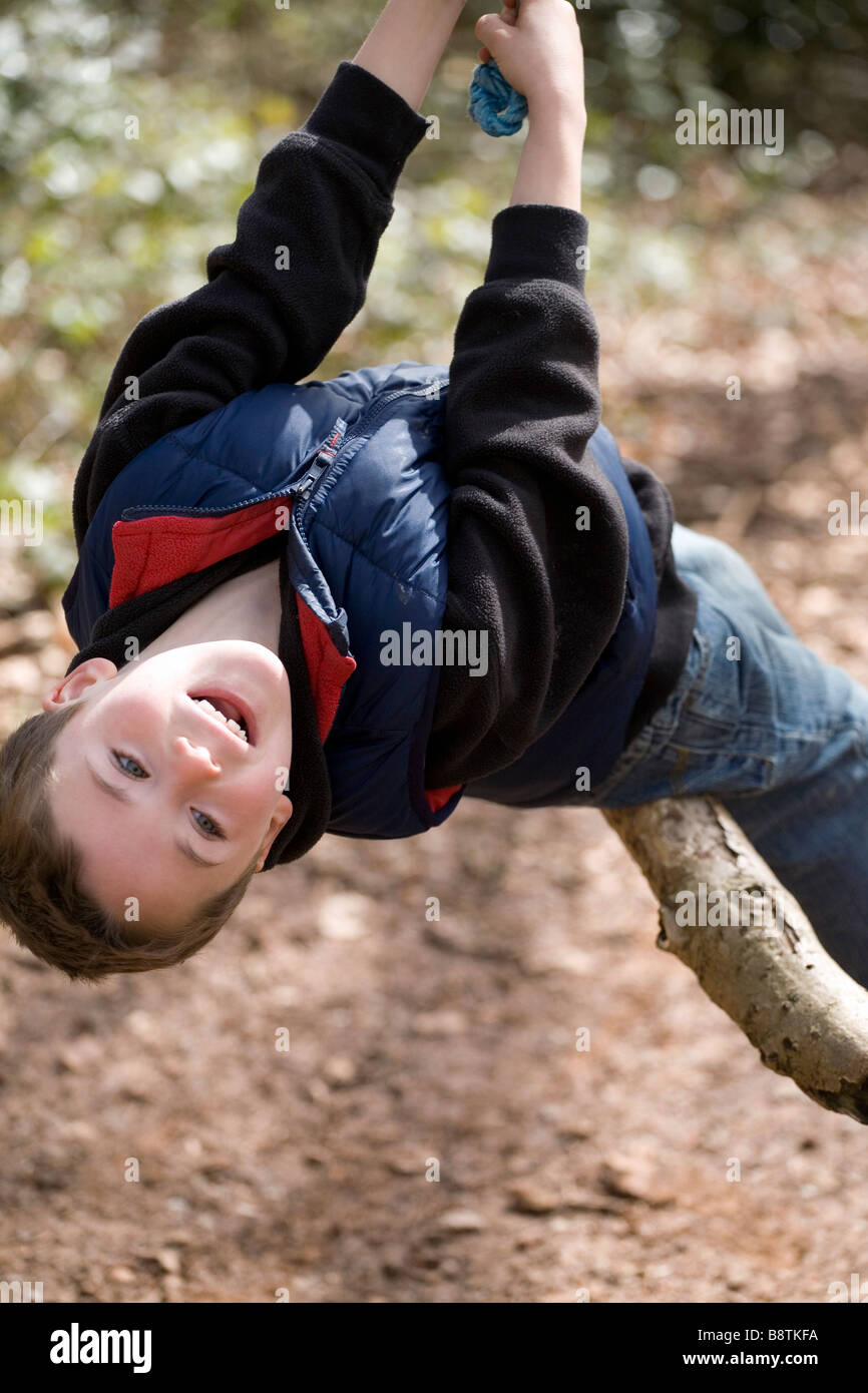 Boy Child Kid Leaning back Rope Swing Tree Woods Stock Photo - Alamy