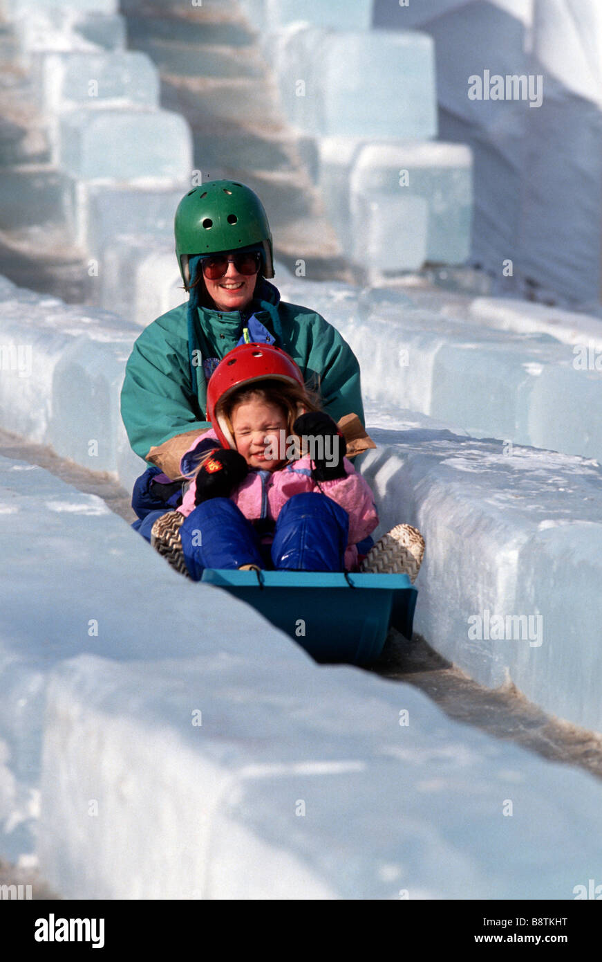 FAMILY FUN ON THE GIANT ICE SLIDE DURING ST. PAUL, MINNESOTA'S ANNUAL ...