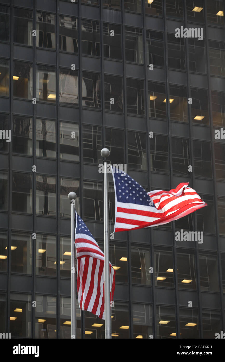 Two American Flags in front of a black glass building Stock Photo - Alamy