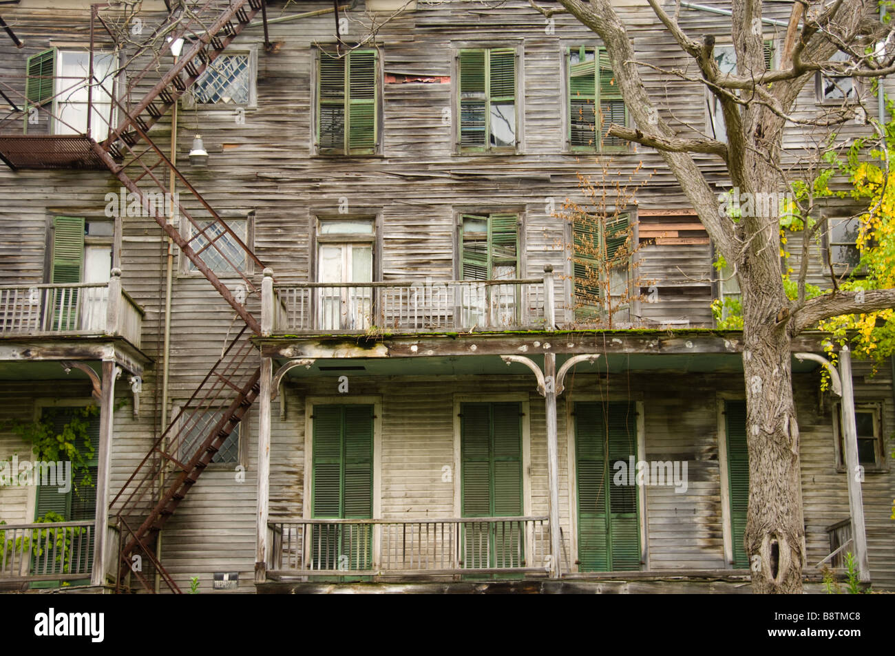 Big old decrepit house with shuttered windows Stock Photo - Alamy