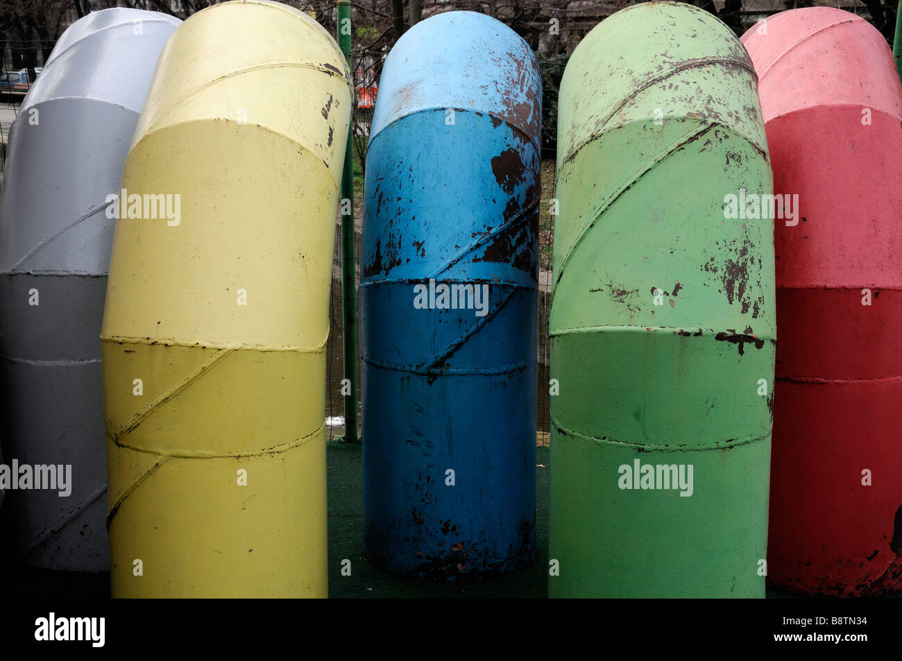 blue yellow red white green ivy covered dirty air conditioning vents ...