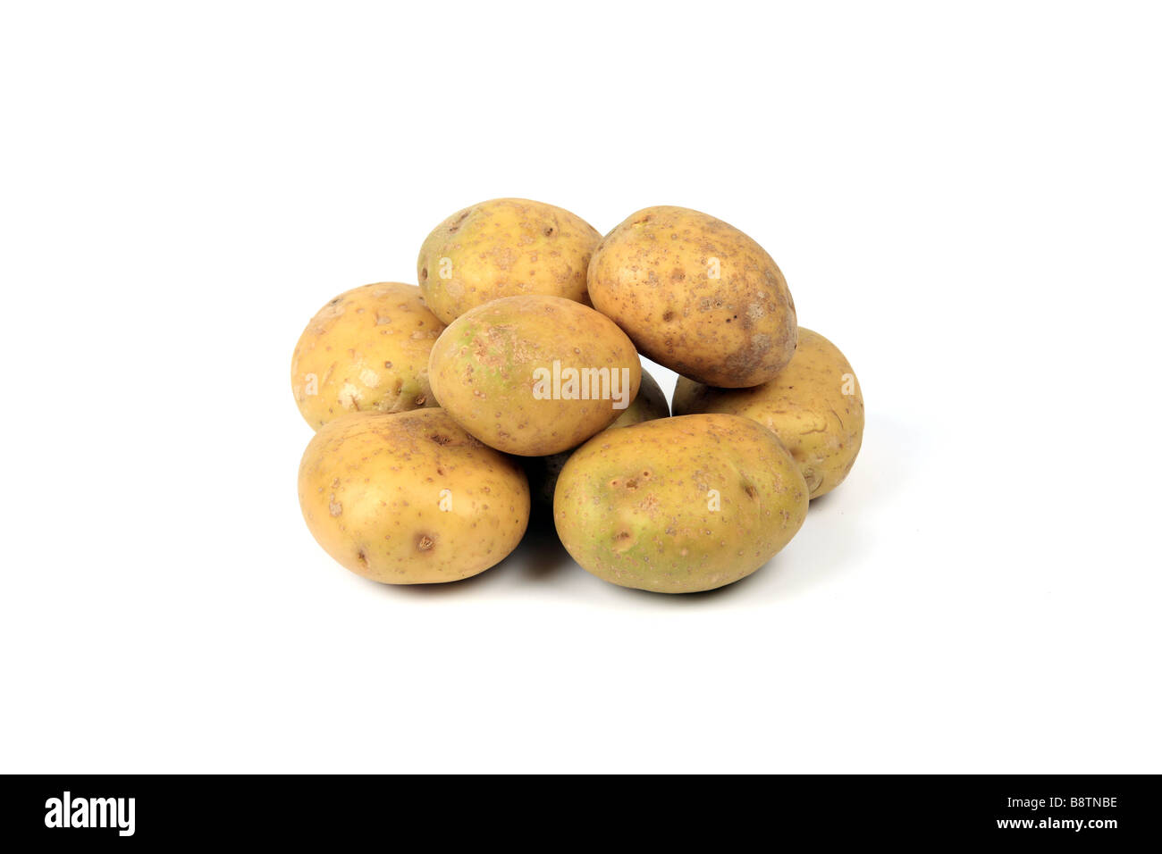 White potatoes staple food of the western world against a white ...