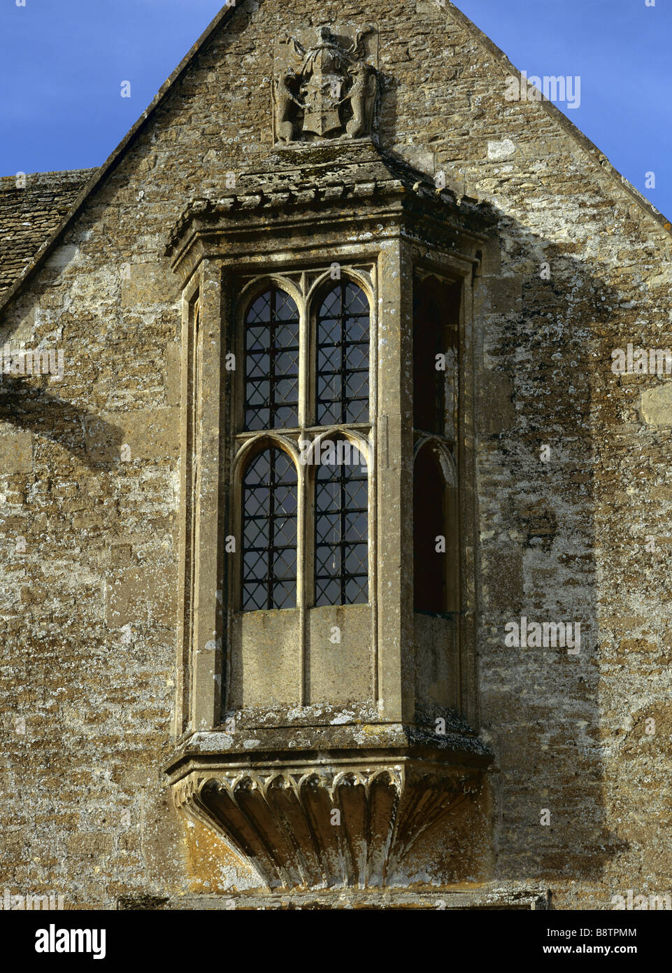 The west of two oriel windows on the north front with a coat of arms ...
