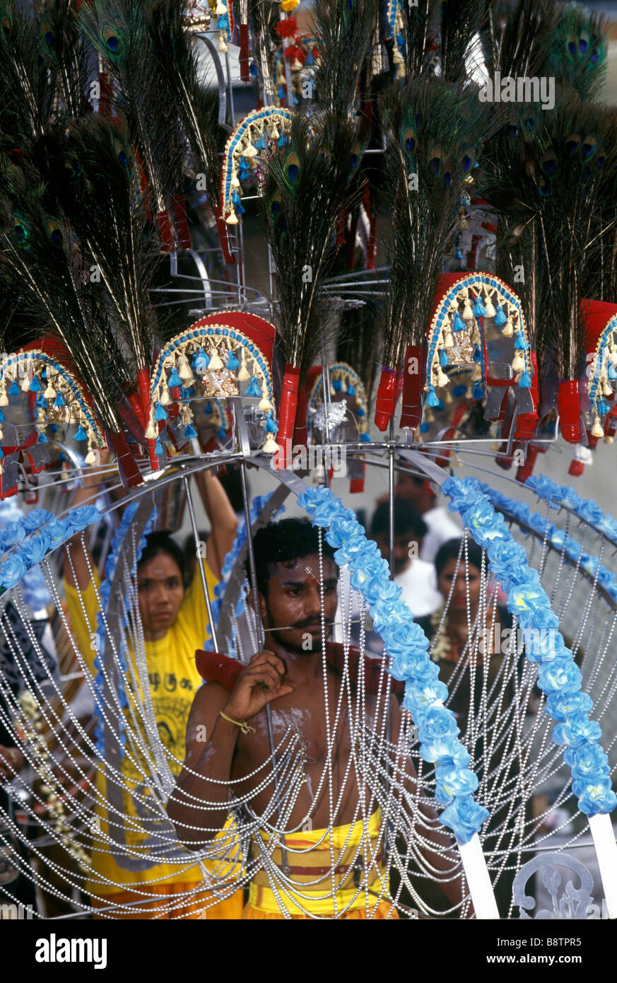 Hindu Indian Devotees wearing kavadis celebrate the birthday of Murugan ...