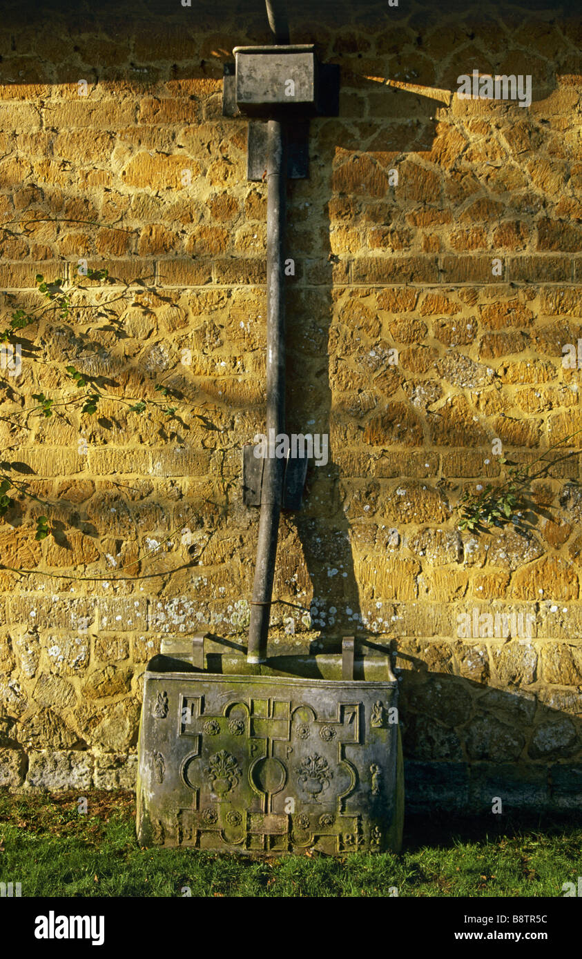 An ornate lead water butt with drain pipe at Barrington Court Stock ...