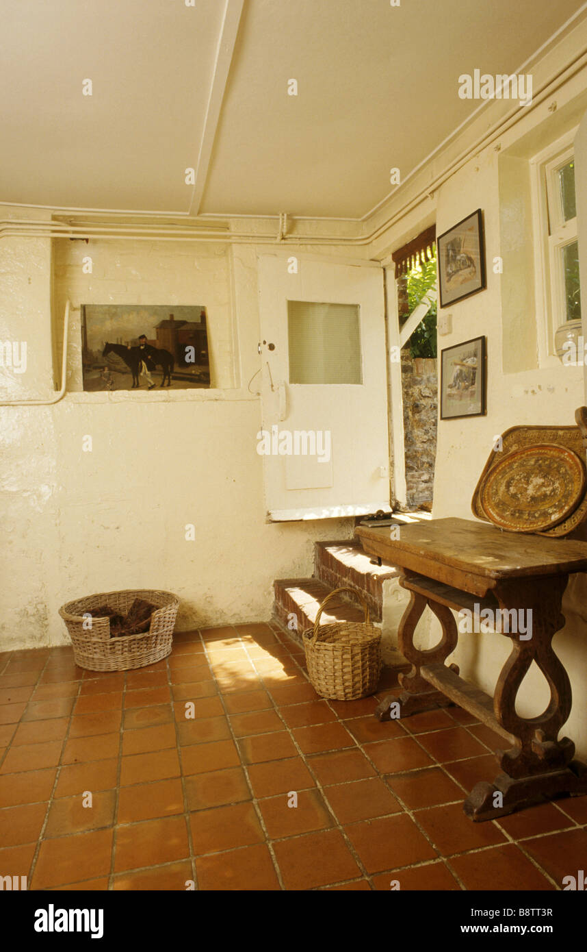 View to the open back door in the Kitchen at Monk s House with a red ...