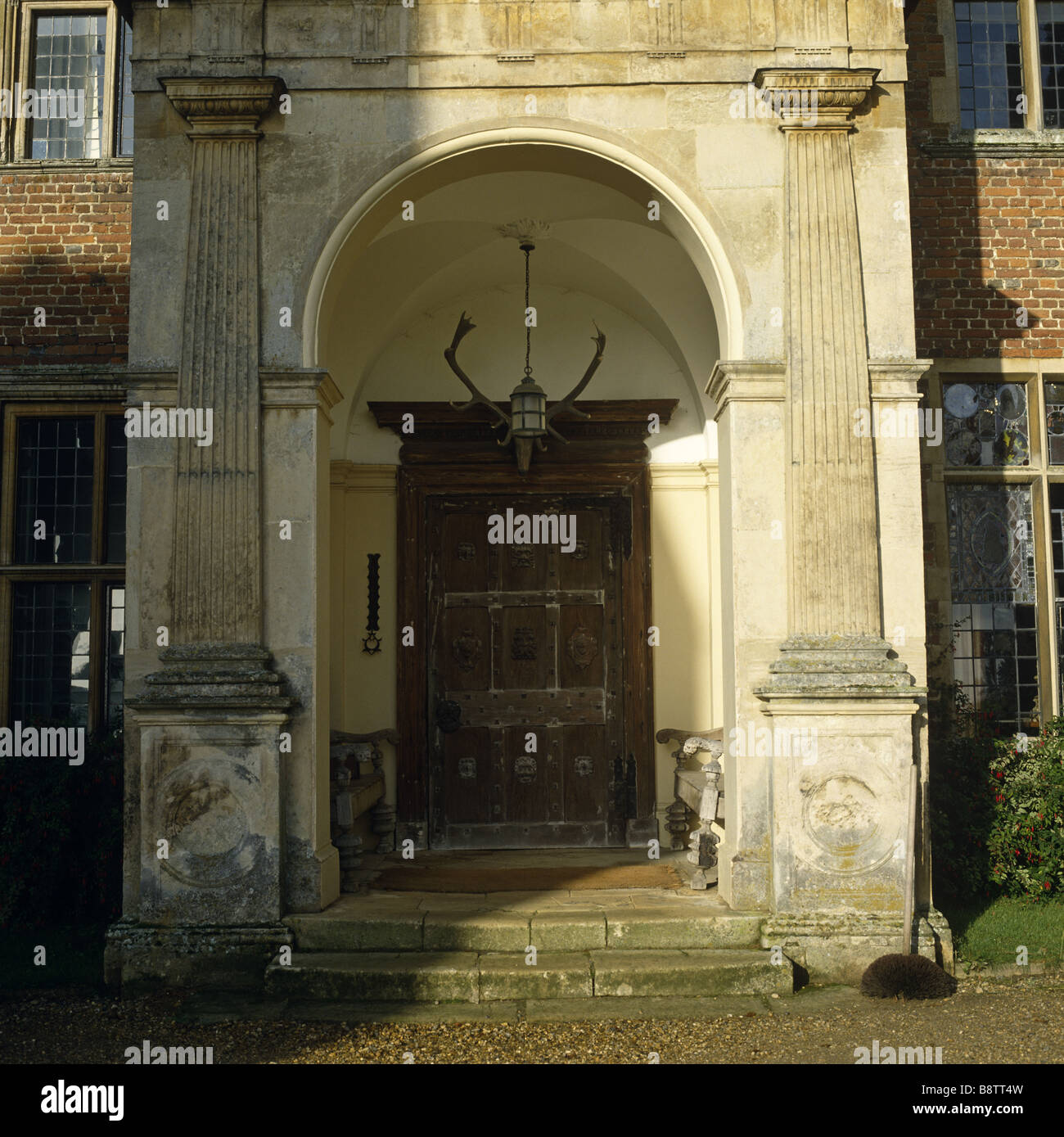The imposing Entrance Portico in the east front, with heavy wooden door ...