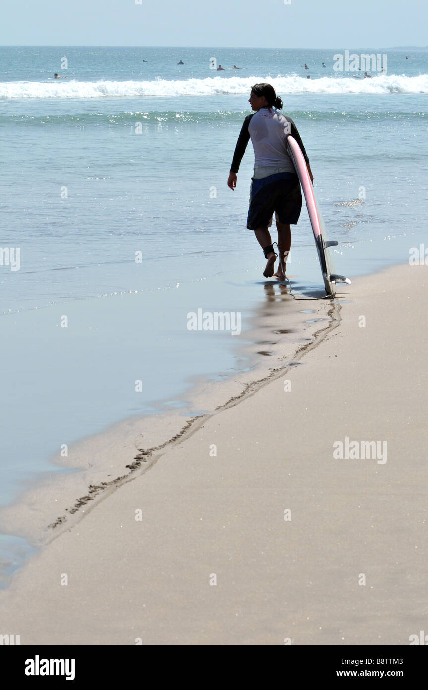 Dragging surfboard hi-res stock photography and images - Alamy