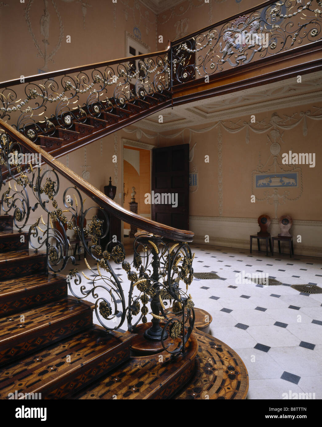 The magnificent staircase with its very elaborate metal balustrade and ...