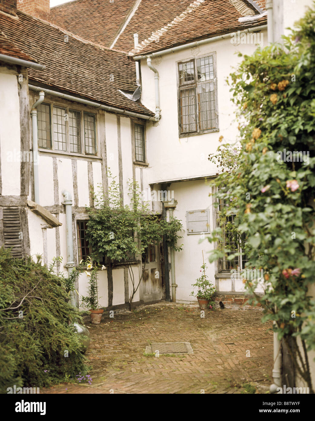 View of the brick paved courtyard at the rear of the House Exposed ...