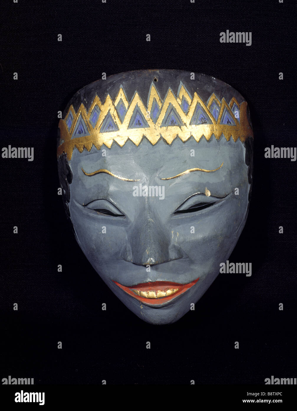 A blue and gold Indonesian mask from Snowshill Manor Stock Photo - Alamy