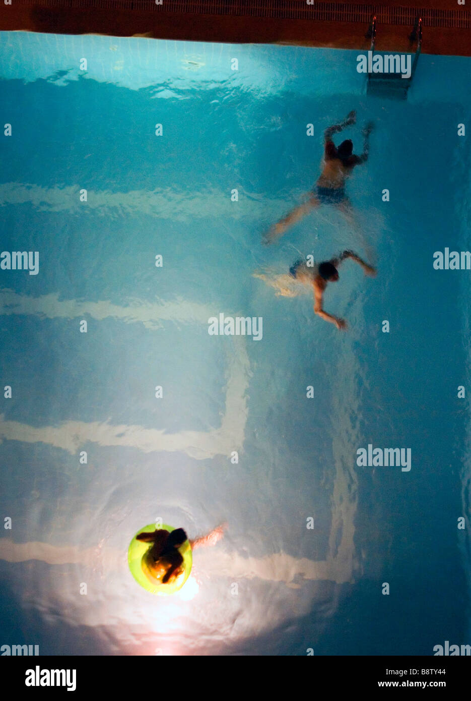 Tourists in pool at night Turkey Stock Photo - Alamy