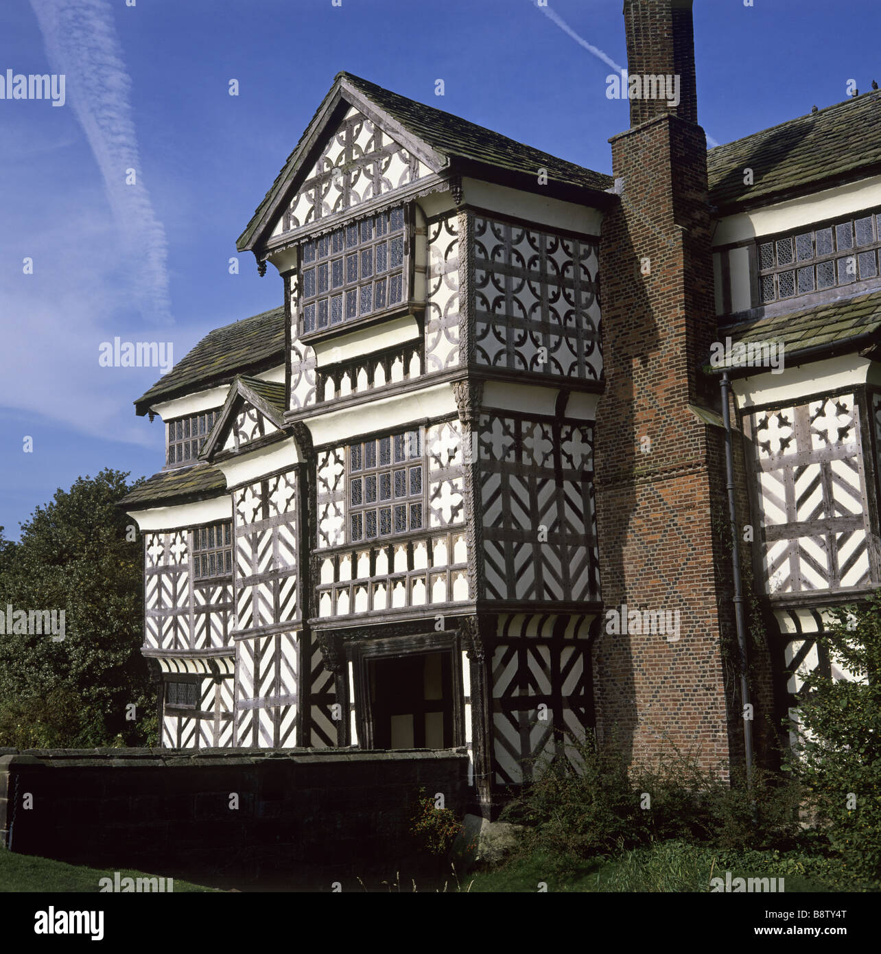 The Gate House on the south front and the red brick chimney with its ...
