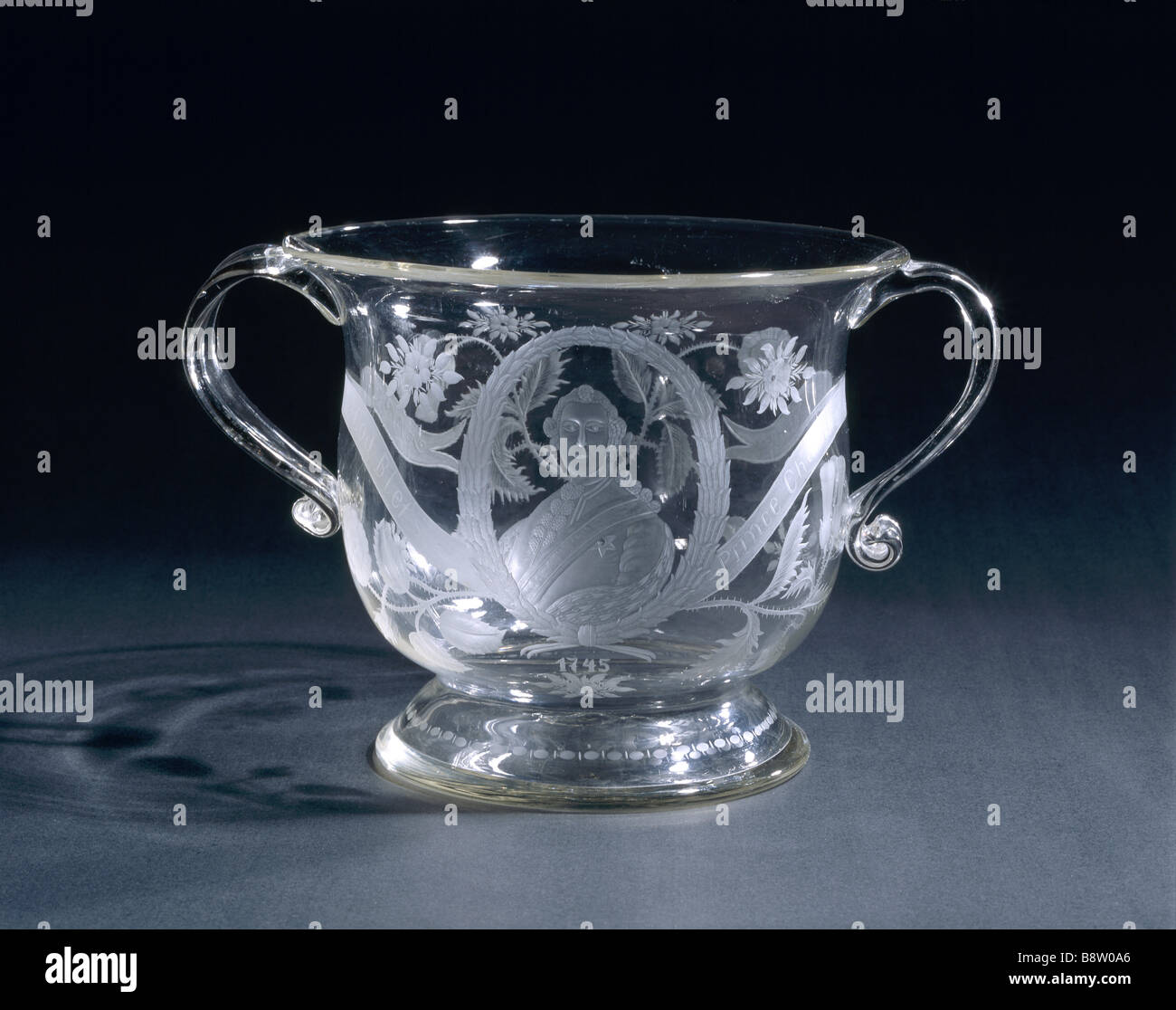 A Jacobite glass vessel with two handles dated 1745 in the Drawing Room ...