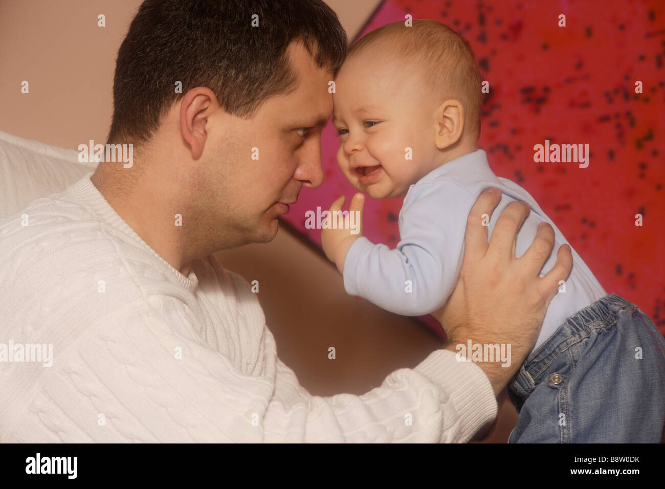 Father Lifting up Son Stock Photo - Alamy