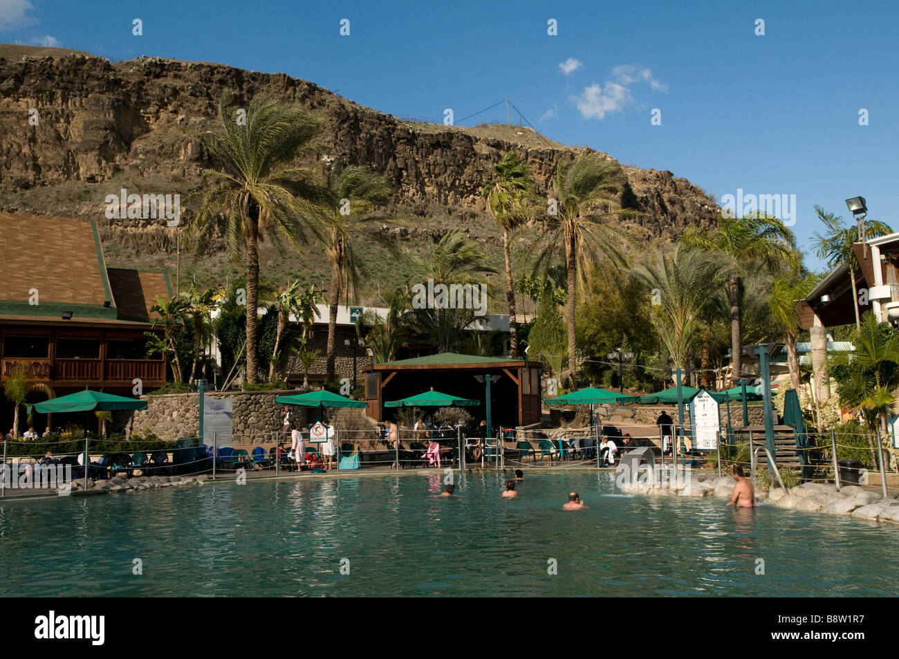 People bath in a pool in Hamat Gader or al-Hamma a hot springs site in the Yarmouk River valley ...