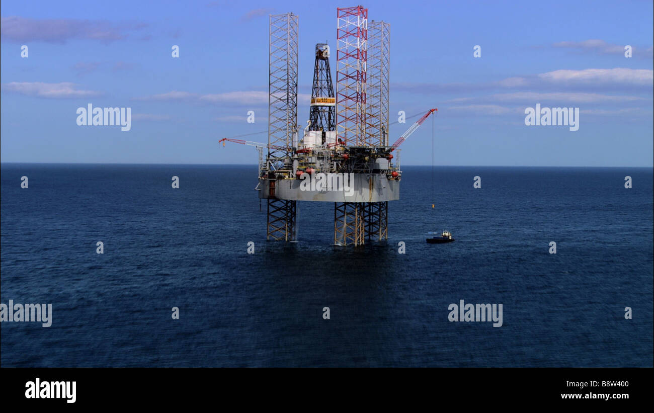Oil Rig with pilot boat Stock Photo - Alamy
