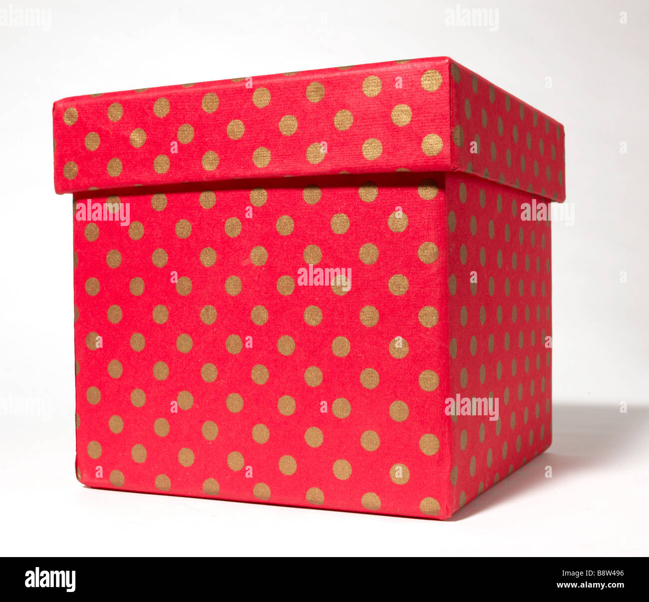 Red and Gold Polka Dot Gift Box Present Stock Photo - Alamy