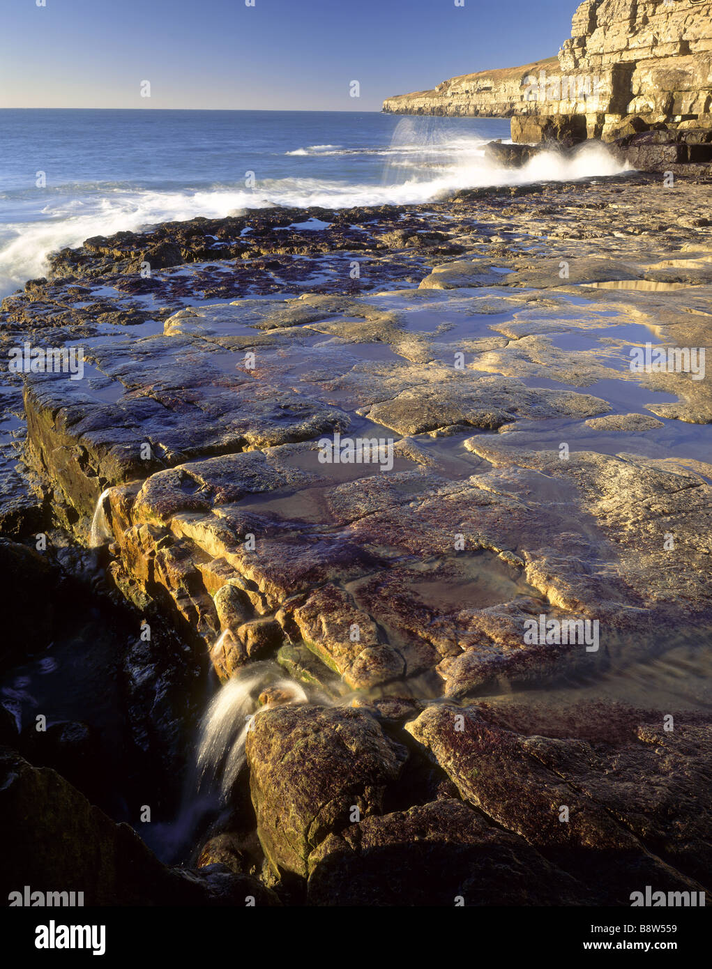 View of sea spray on the wave cut platform below Seacombe Cliff in ...