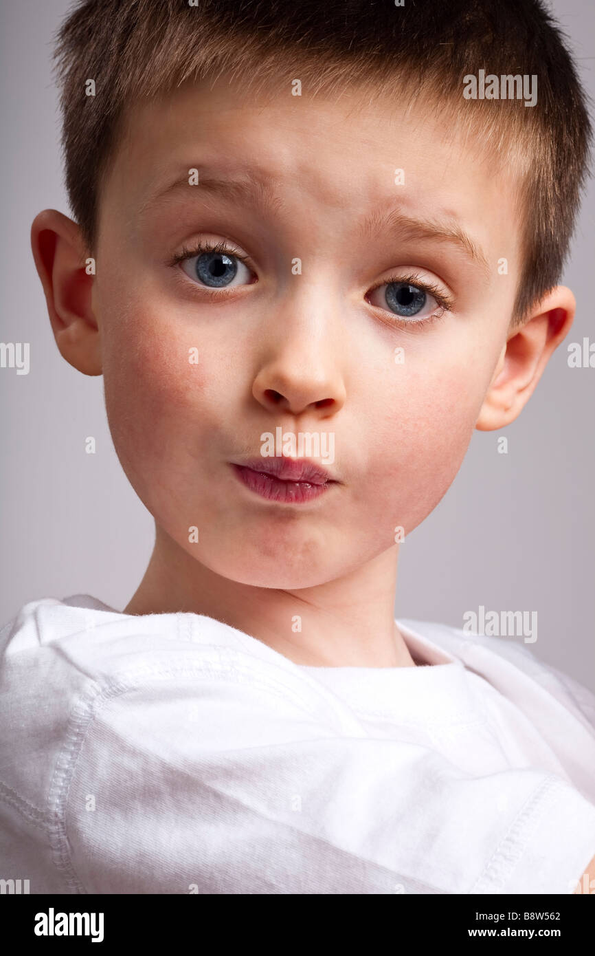 Little boy with pouting facial expression Stock Photo - Alamy