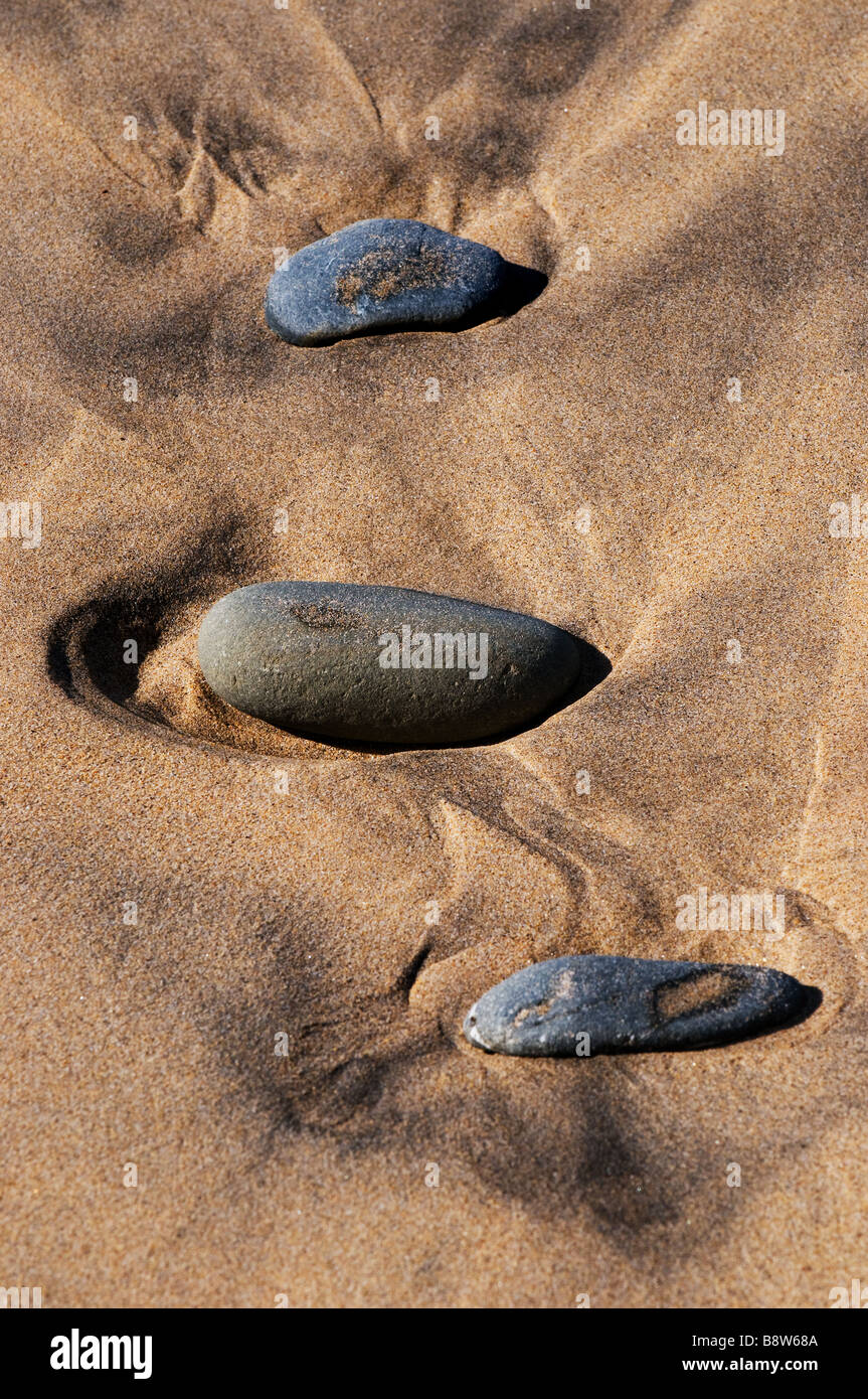 Three pebbles on Gwithian Towans Beach in Cornwall Stock Photo - Alamy