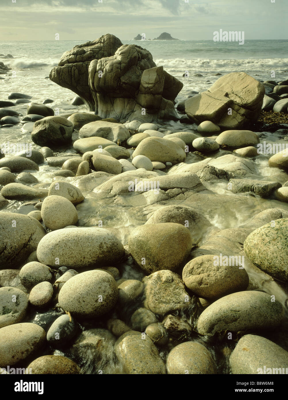 A view of The Brisons with large colourful rocks reaching out towards ...
