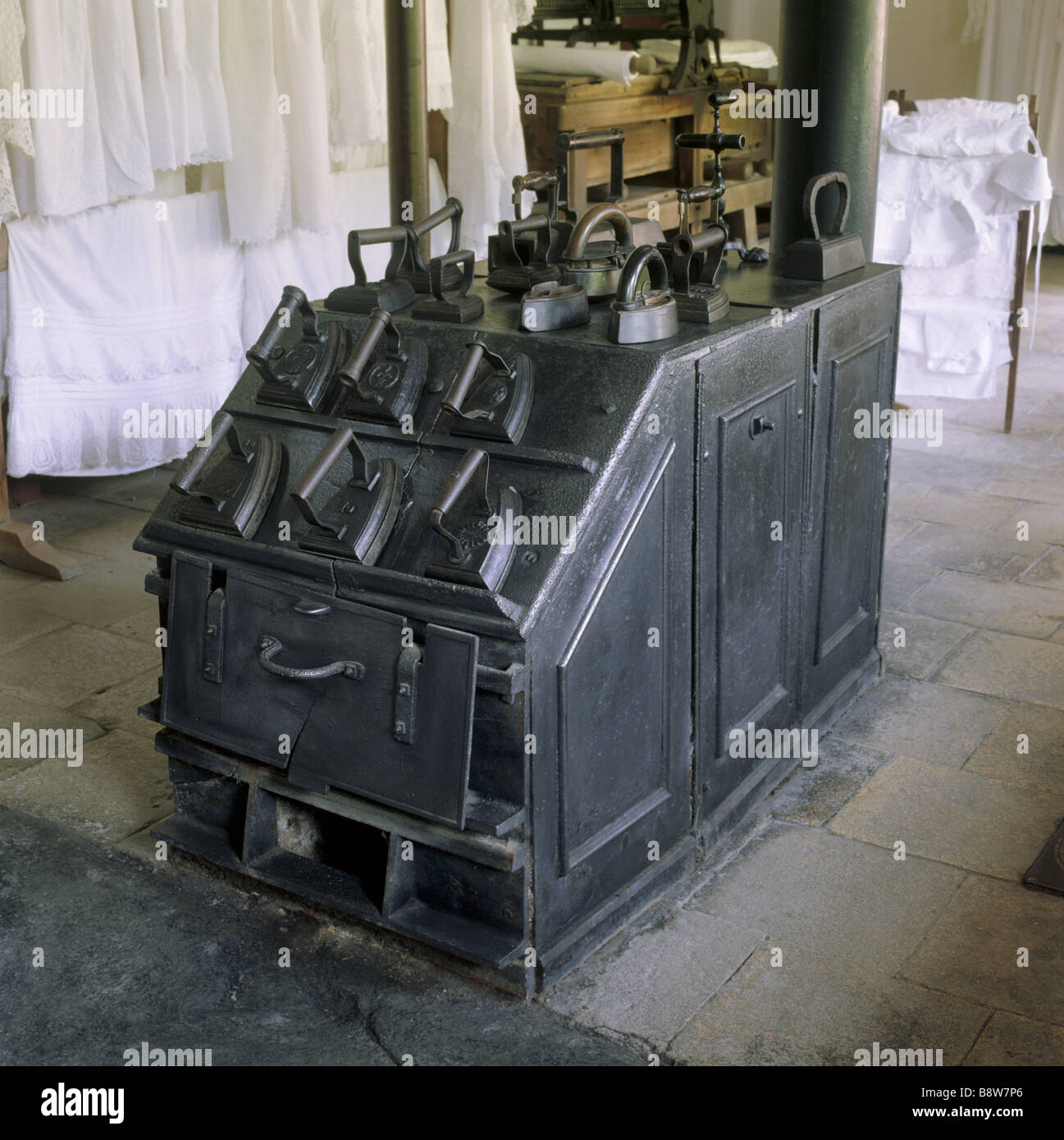 The Laundry Castle Ward View of a stove used for heating irons Irons of ...
