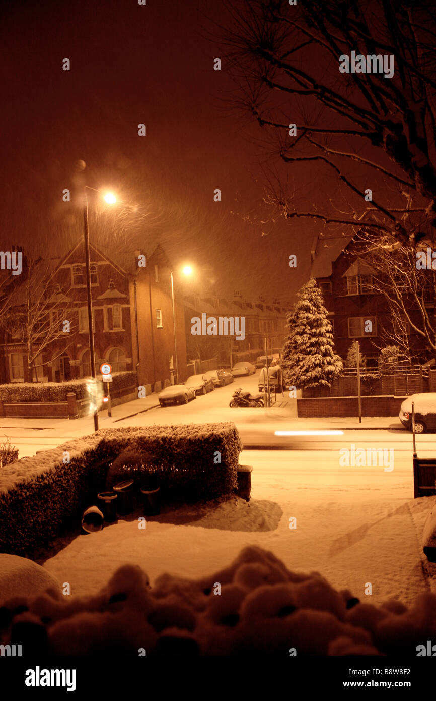 Snowy street at night Stock Photo - Alamy