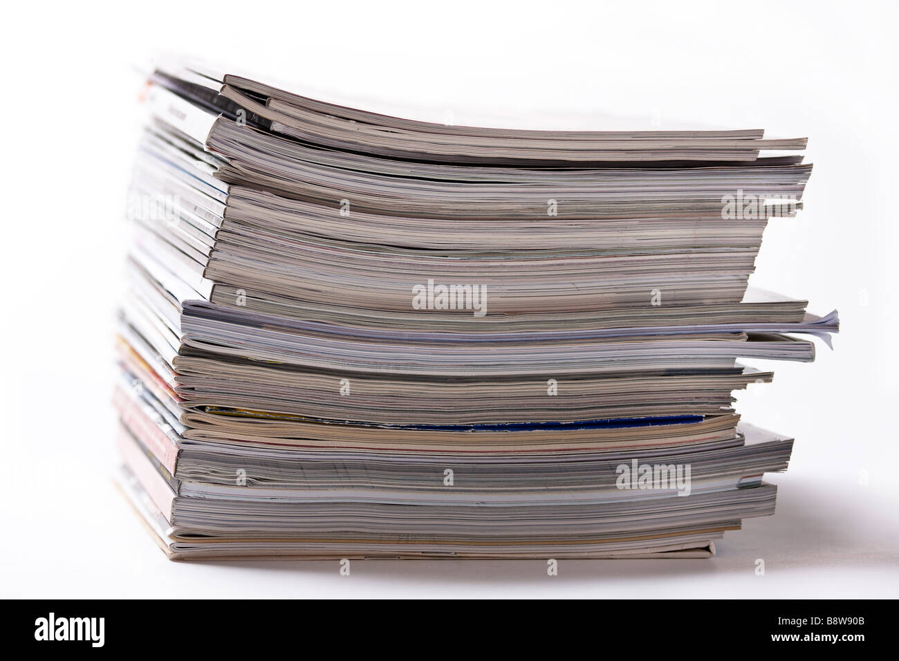 Studio shot of a pile of magazines Stock Photo - Alamy