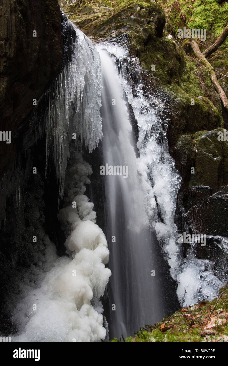 Frozen waterfall on mountain stream Falls at Robbers Cave Hafod ...
