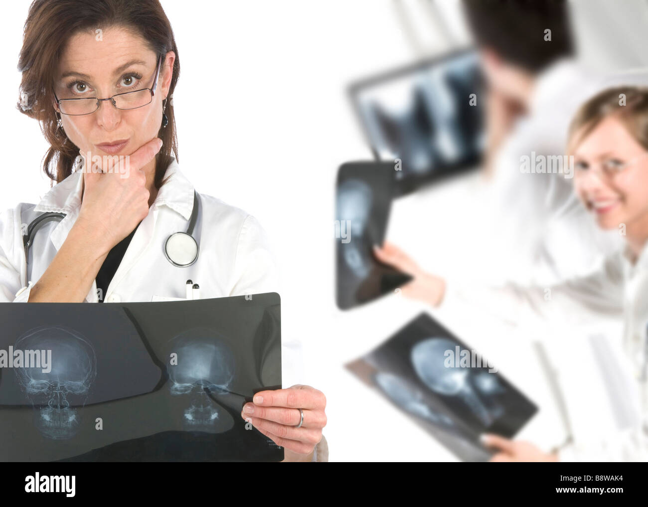friendly young doctors smiling over a white background focus is on the ...