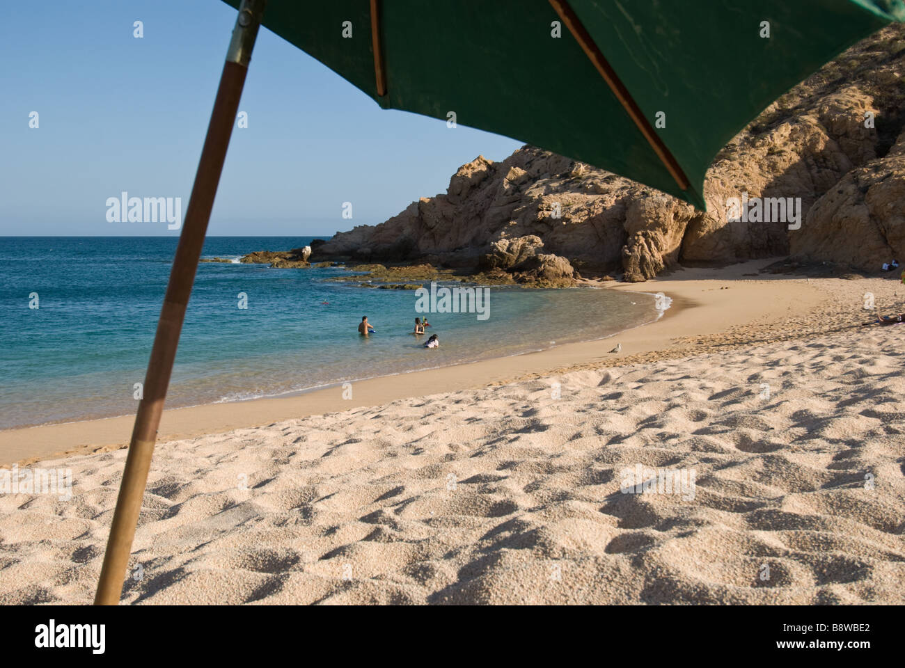 A family enjoying themselves at Santa Maria beach in southern Baja ...
