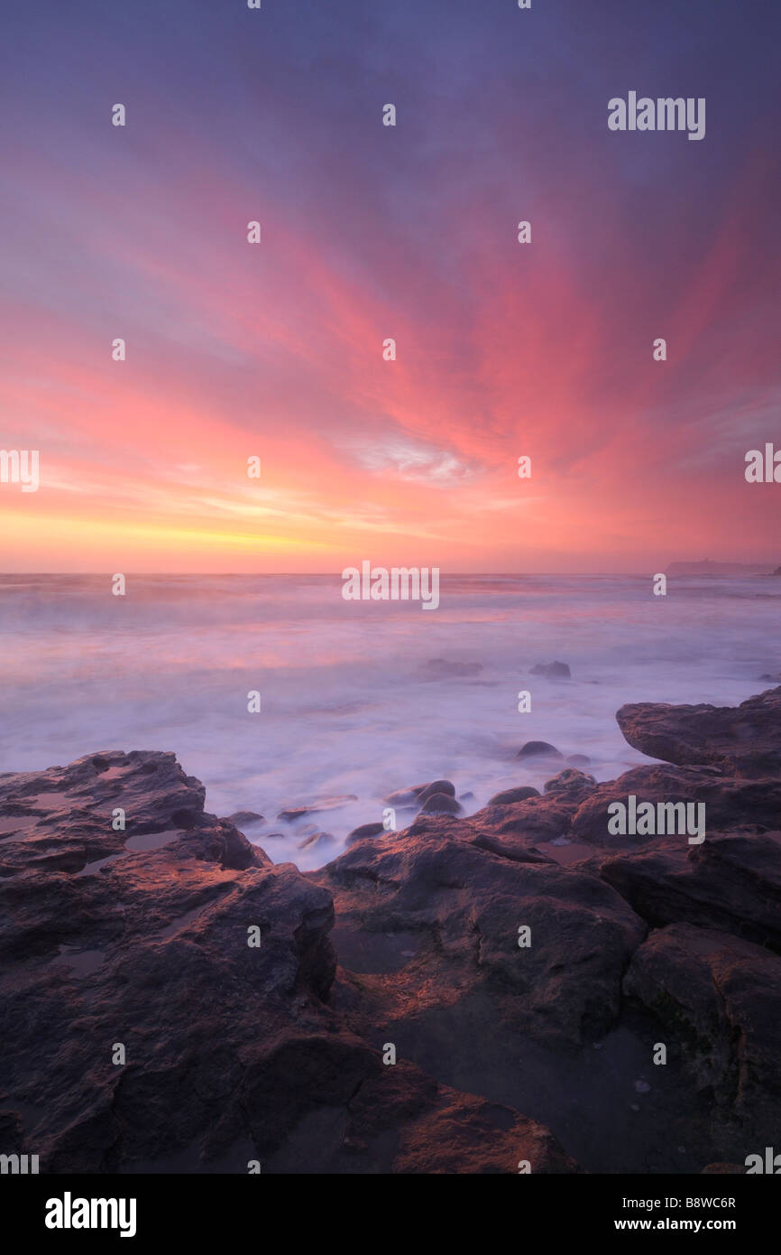 A red dawn at Burniston near Scarborough on the east coast of Yorkshire ...