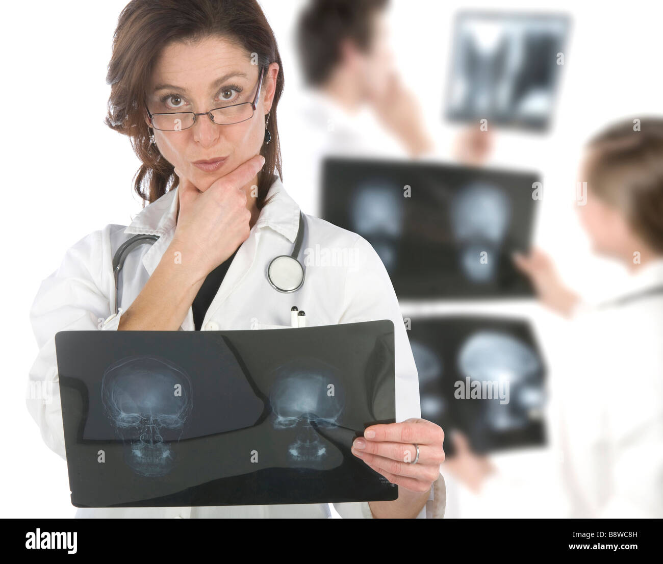 friendly young doctors smiling over a white background focus is on the ...