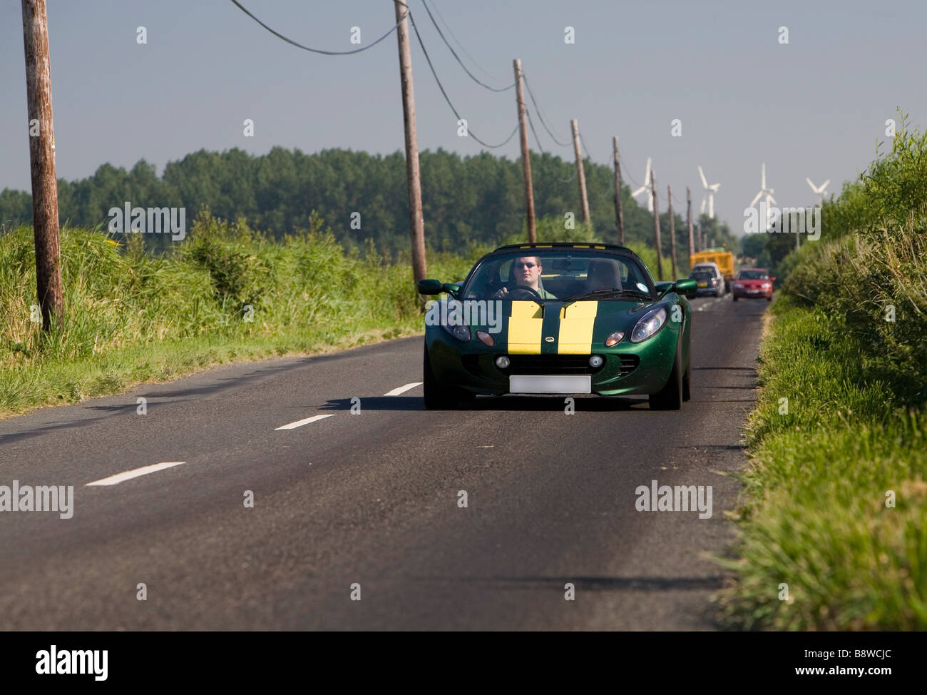 Open-top sports car on Norfolk coast road Stock Photo - Alamy