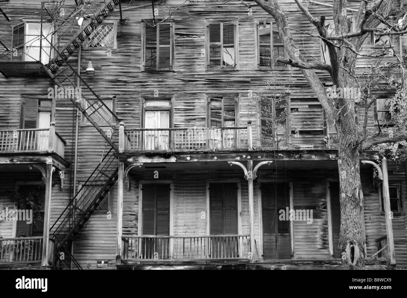 Big old decrepit house with shuttered windows Stock Photo - Alamy