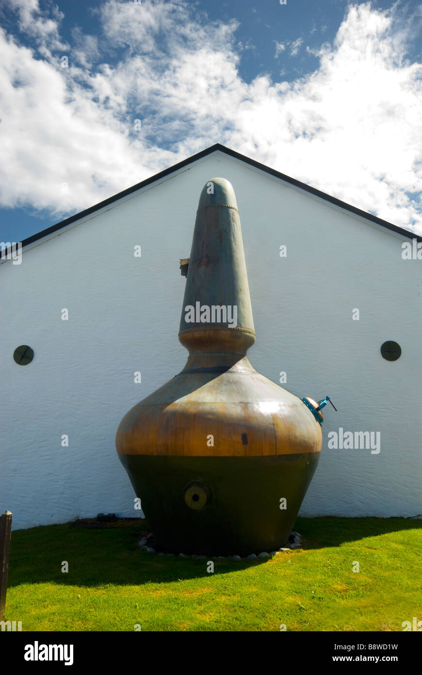 photograph of copper whiskey still outside distillery Stock Photo - Alamy