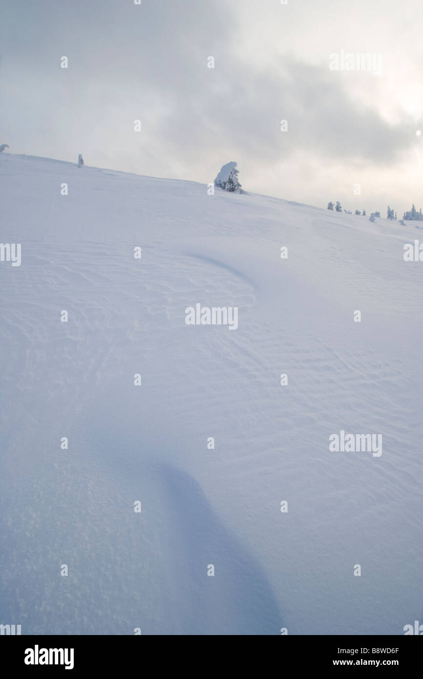 Snowdrift on a hill Stock Photo - Alamy