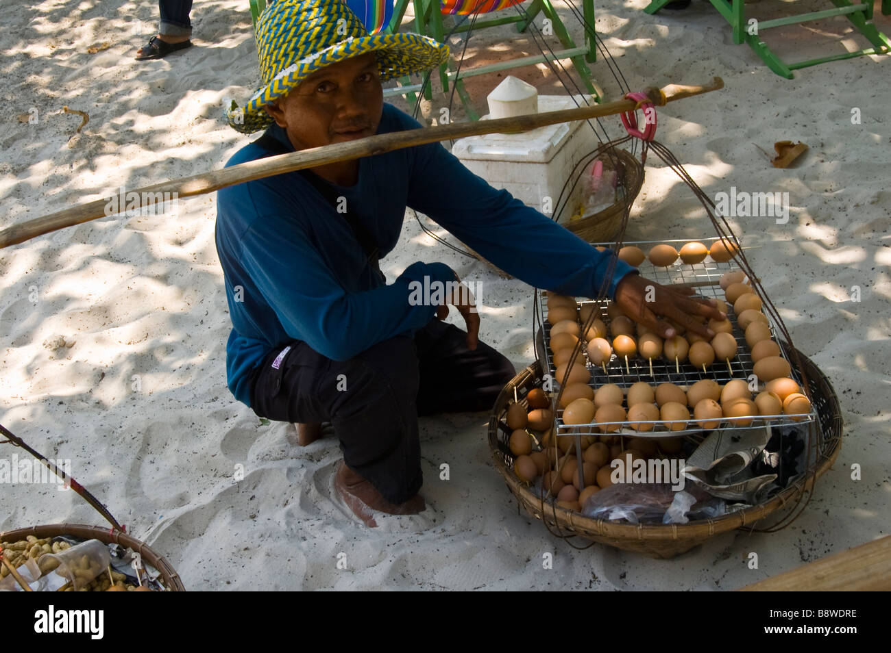 Egg vendor with traditional yoke on Koh Samet island, Thailand Stock ...