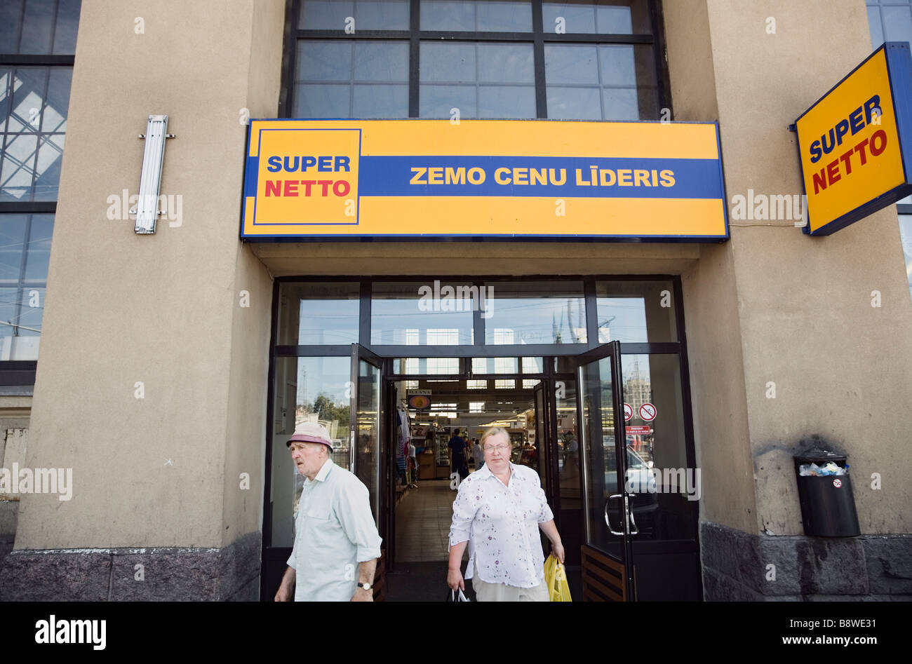 Riga Latvia Europe, elderly couple outside the Supernetto supermarket ...