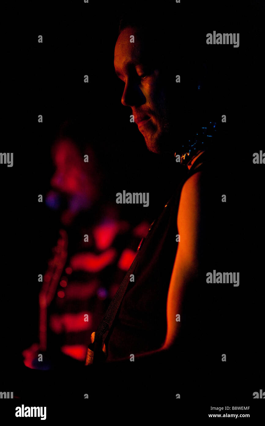 men playing guitar in rock band Stock Photo - Alamy