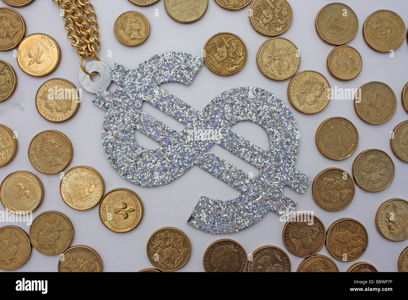 SPARKLING SILVER DOLLAR SIGN SURROUNDED BY GOLD COINS WHITE BACKGROUND ...
