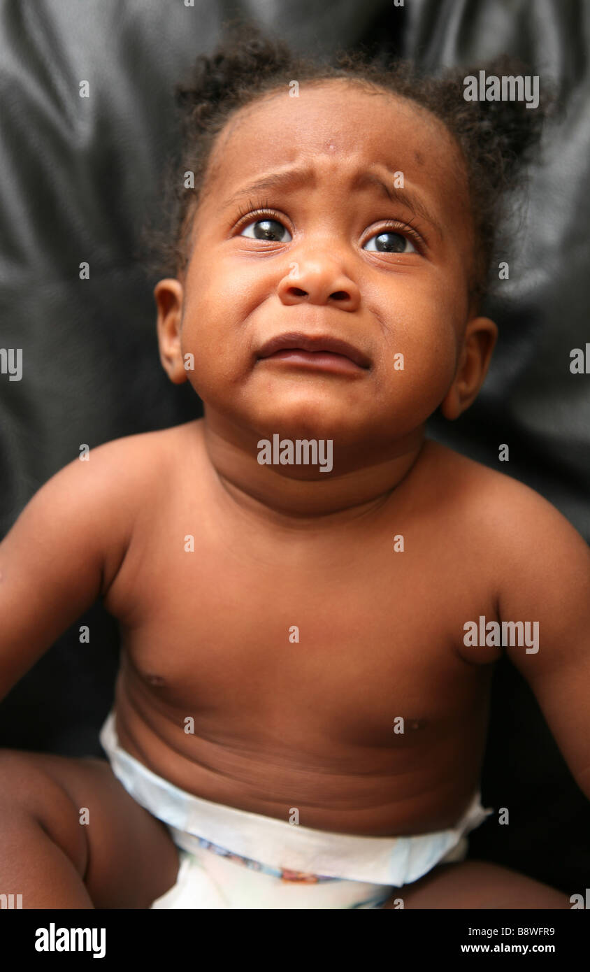 Over tired little girl crying Stock Photo - Alamy