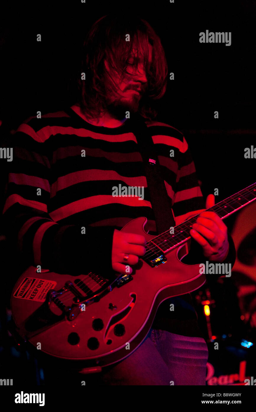 man playing guitar in rock band Stock Photo - Alamy