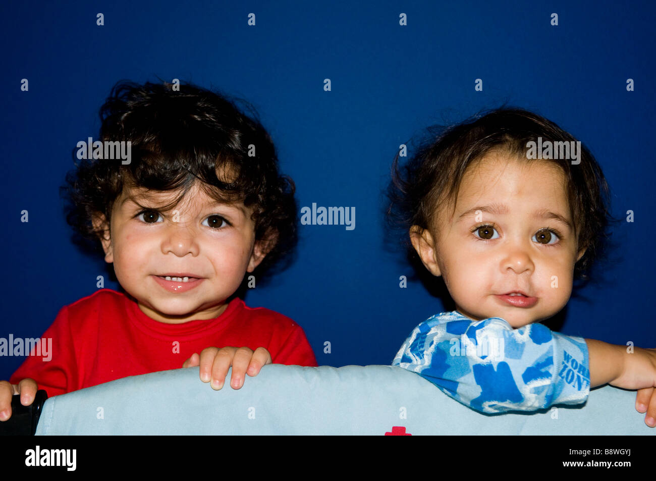 Cute twins play together Stock Photo - Alamy
