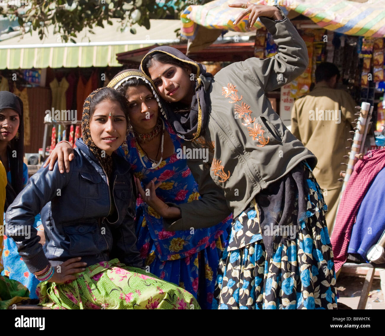 Indian women pose for camera Pushkar Rajasthan India Stock Photo - Alamy