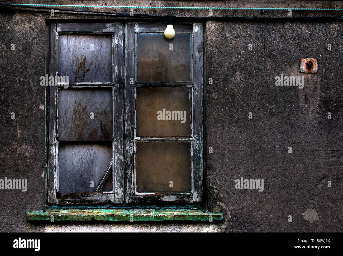 A dilapidated window in a concrete wall Stock Photo - Alamy