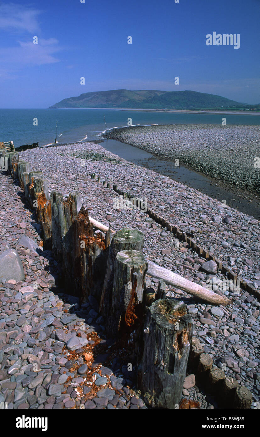 The pebble beach at Porlock Weir in Exmoor Somerset with Hurlstone ...