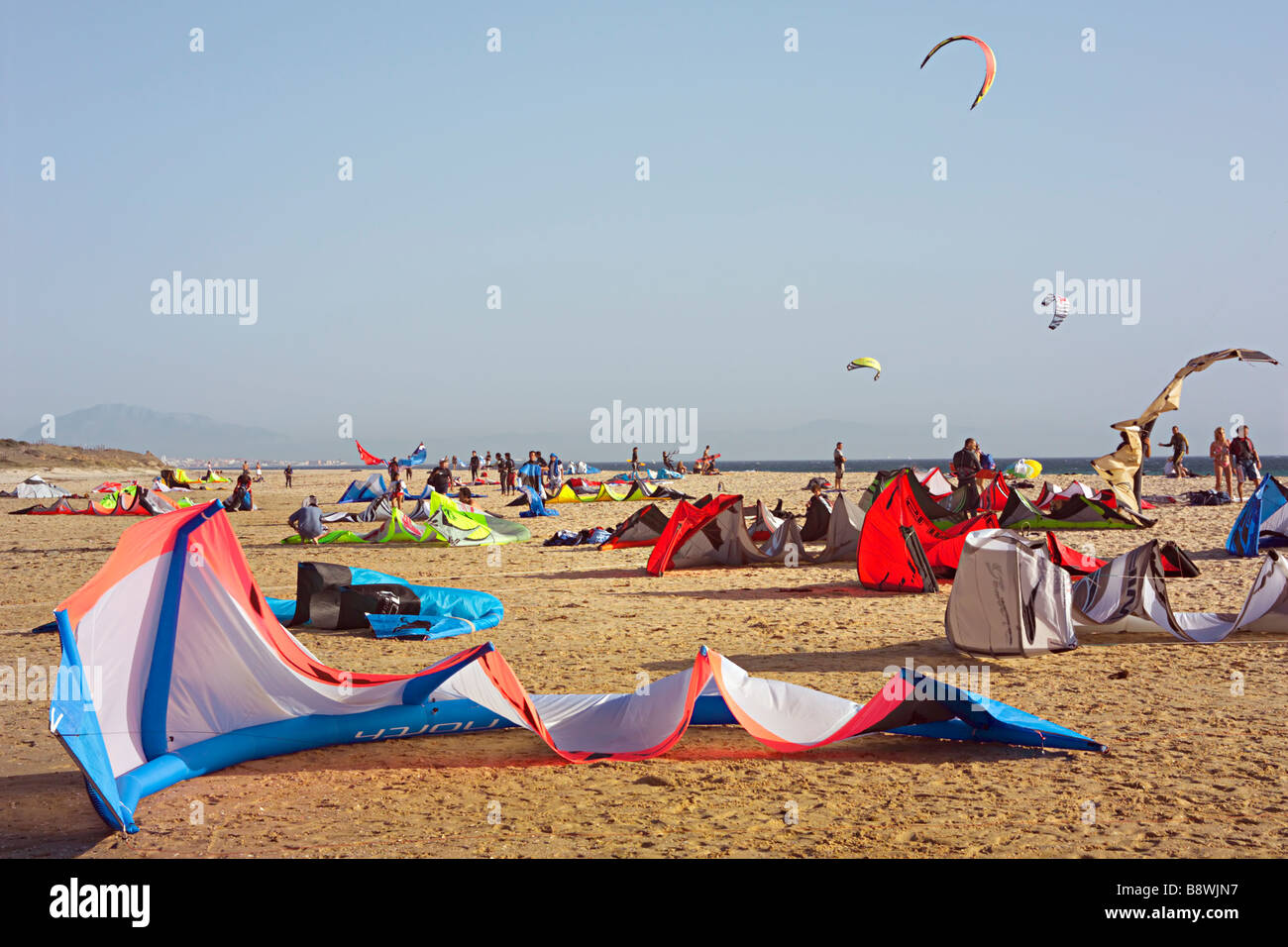 kite surfers rigging up and launching kites on the beach at Tariffa ...