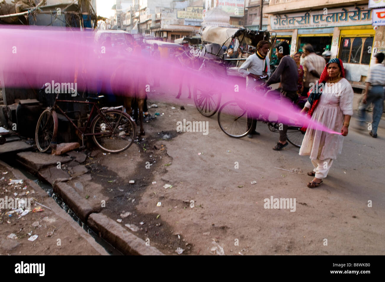 Daily scenes in the streets of India. women dry and fold their colorful ...